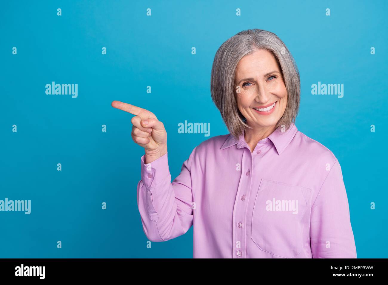 Photo of positive satisfied businesswoman bob grey hair indicate finger ...