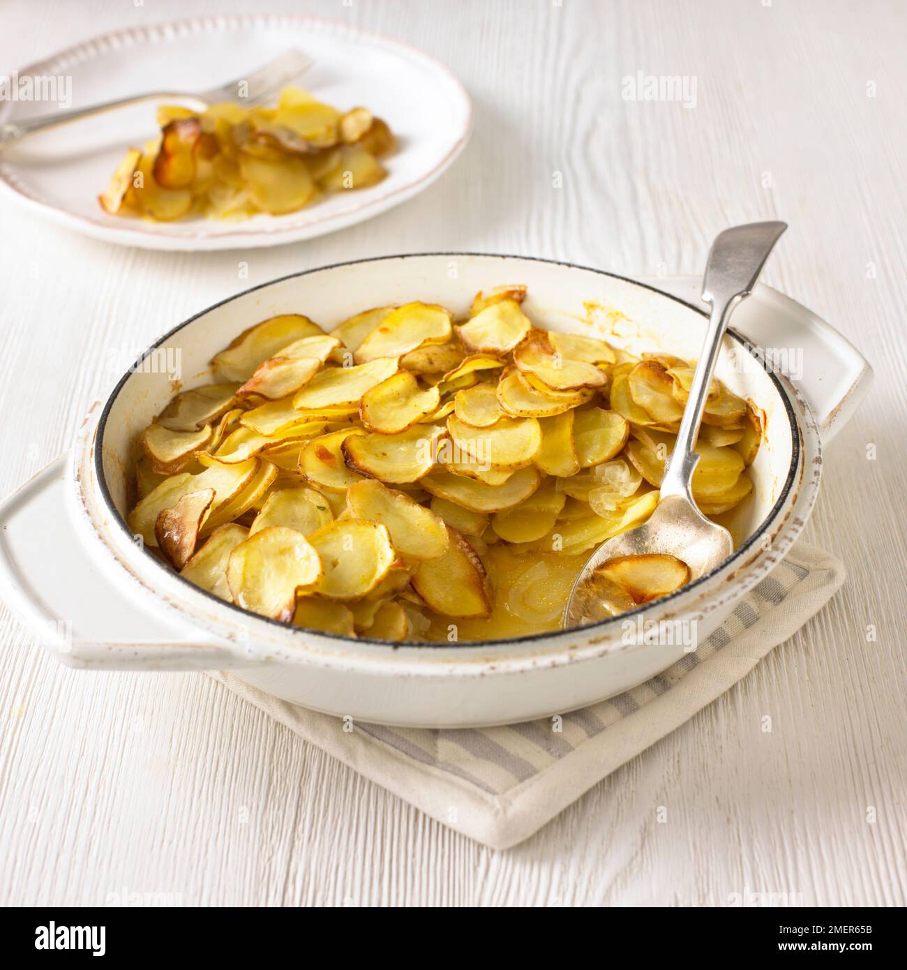 Thinly sliced potatoes hi-res stock photography and images - Alamy