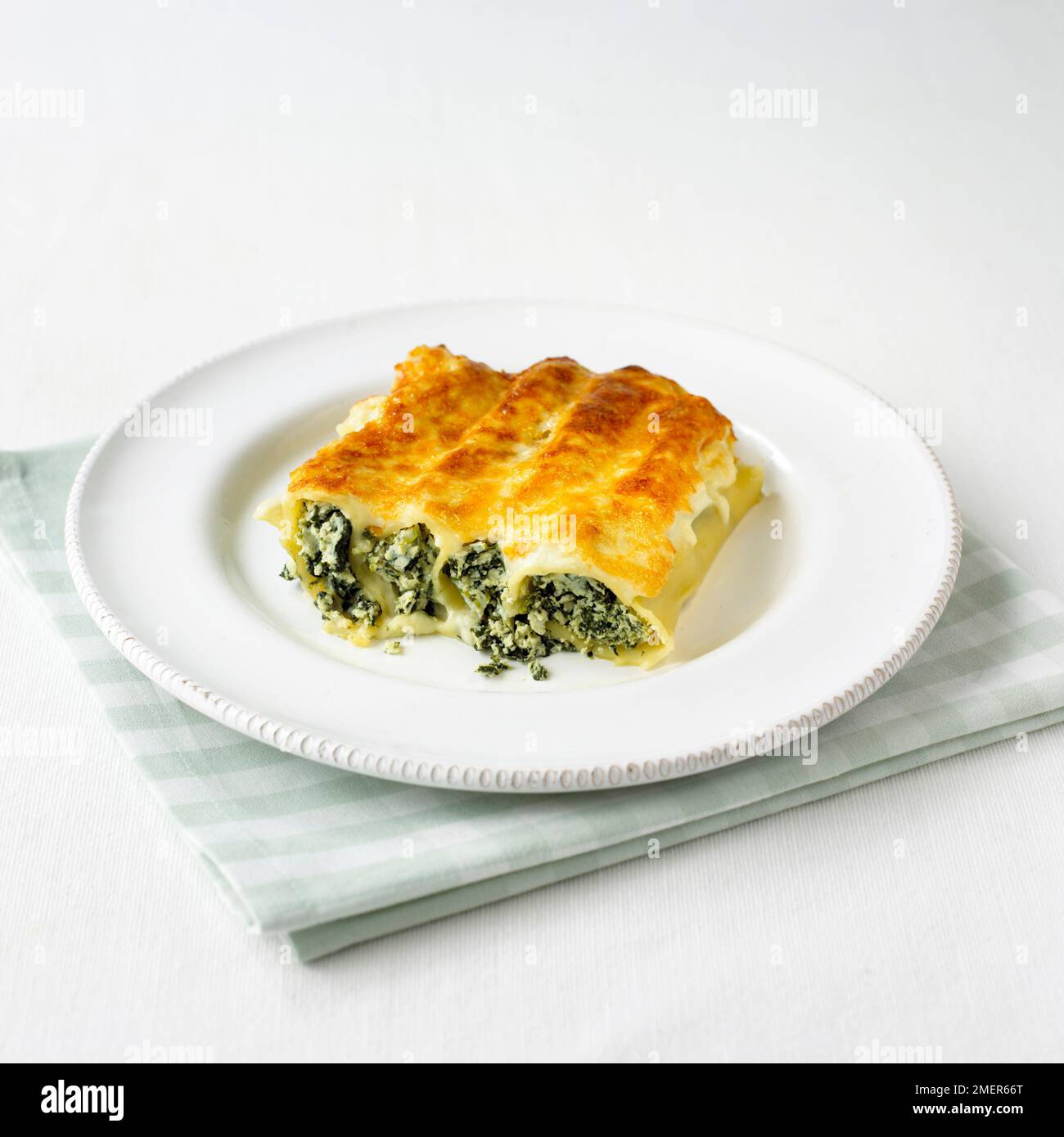 Cheese and spinach pancake cannelloni Stock Photo - Alamy
