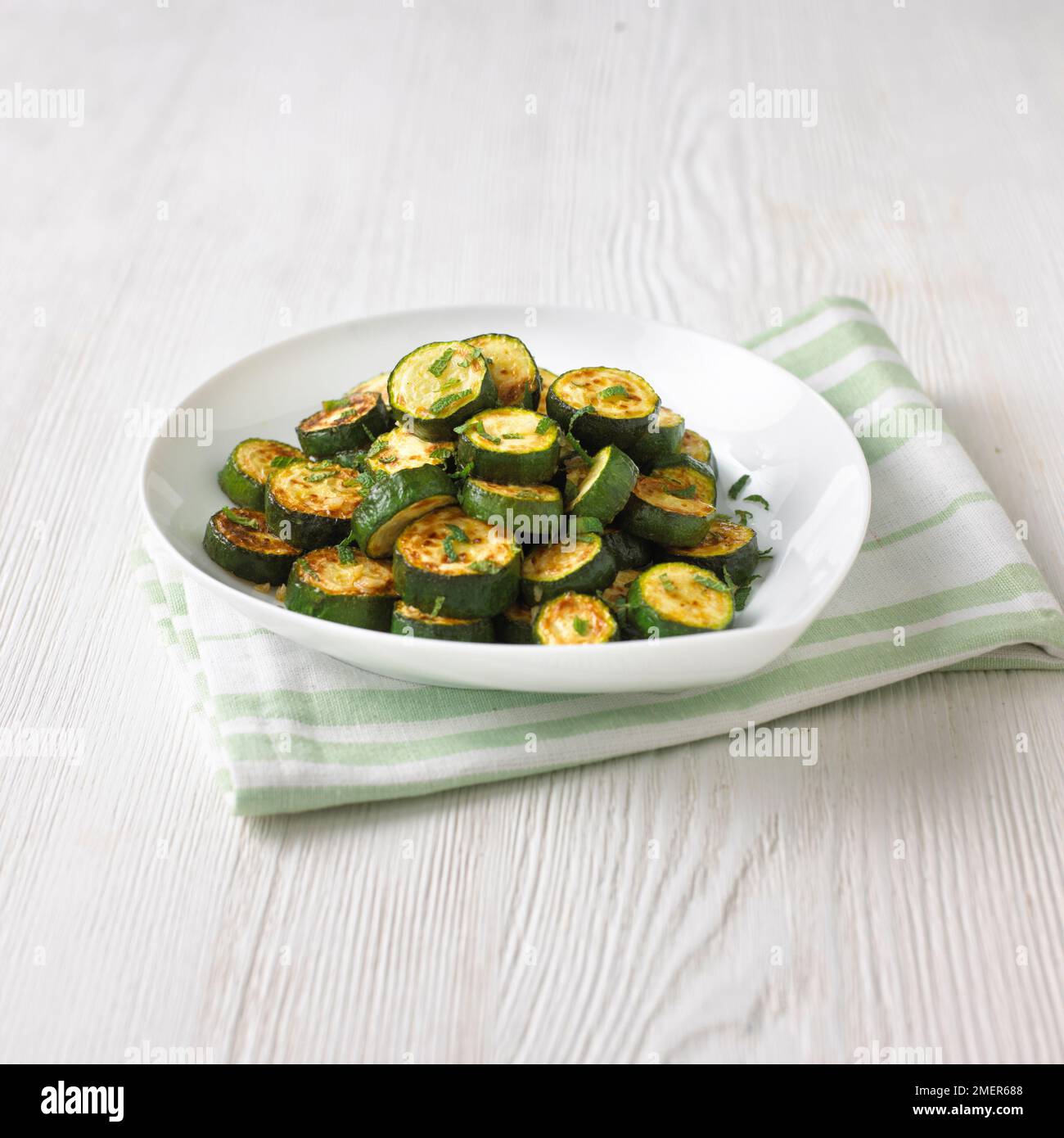 Courgettes with mint and garlic Stock Photo - Alamy