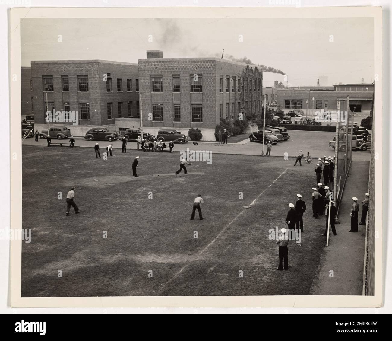 This photograph shows a baseball game between officers and unlicensed ...