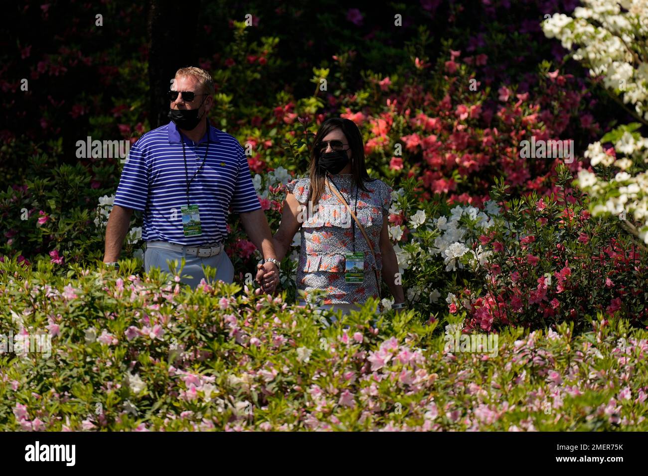 Patrons walk along the sixth hole during a practice round for the ...