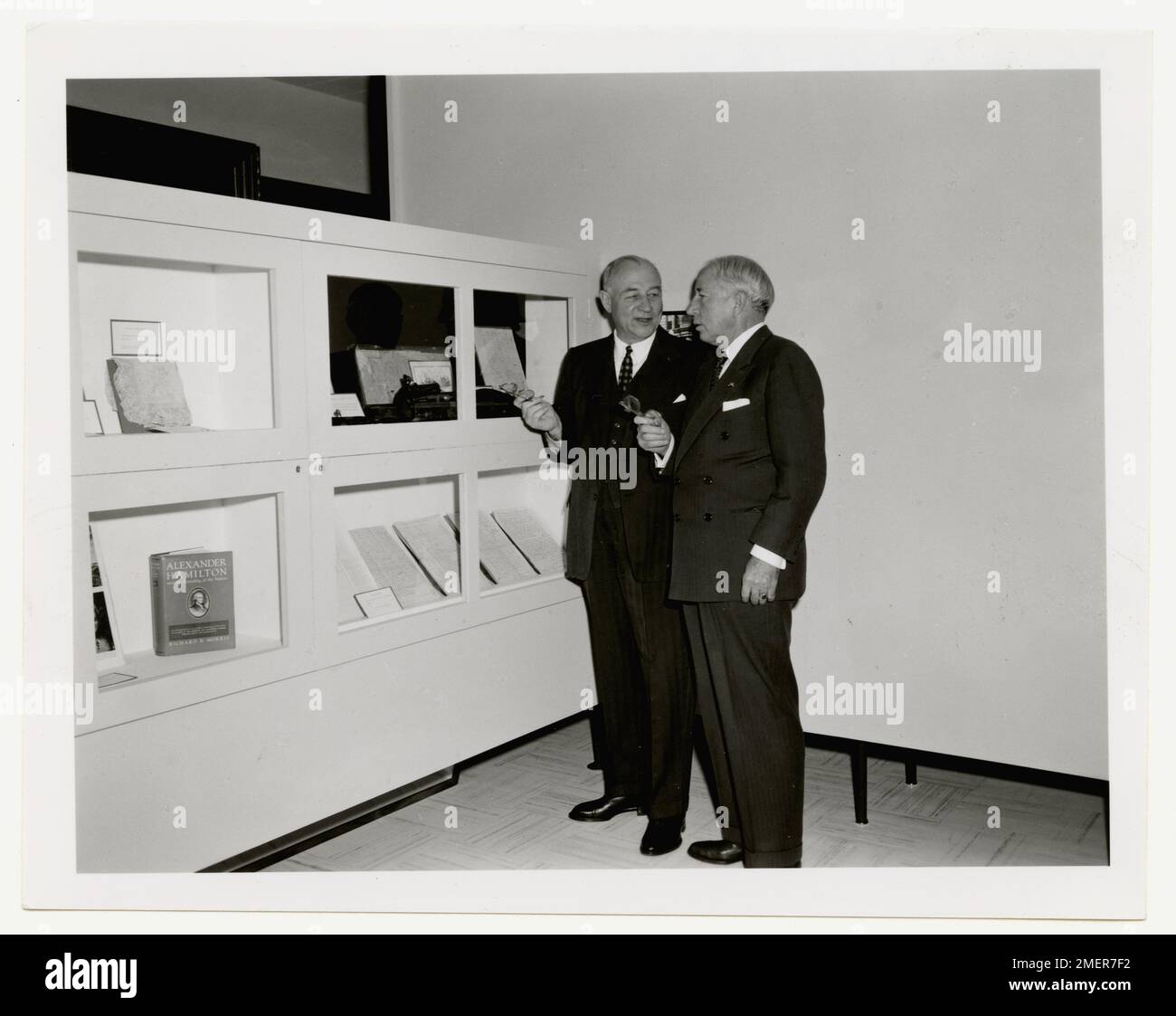 An image of two men viewing the Alexander Hamilton exhibit, showcasing ...