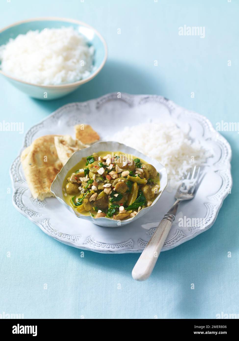 Mushroom spinach curry with rice Stock Photo - Alamy