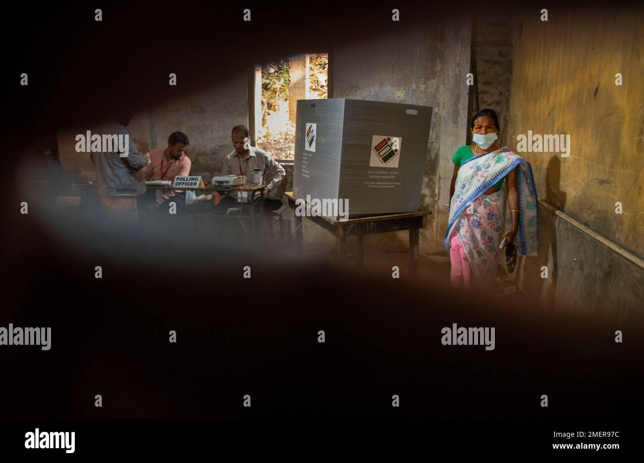 A woman leaves after casting her vote at a polling station during the ...