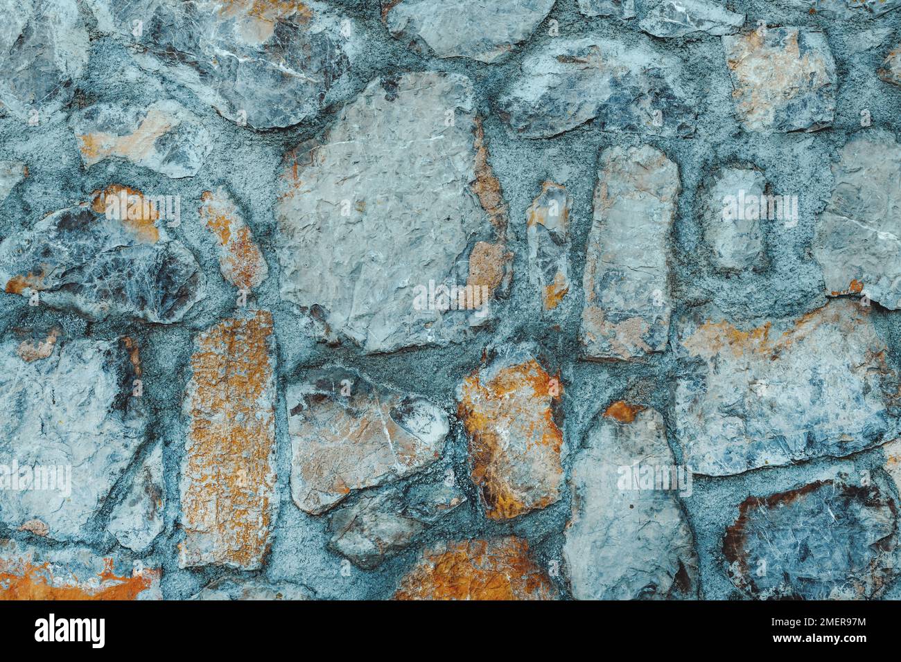 Old worn stone wall in croatian town of Lovran as background Stock Photo - Alamy