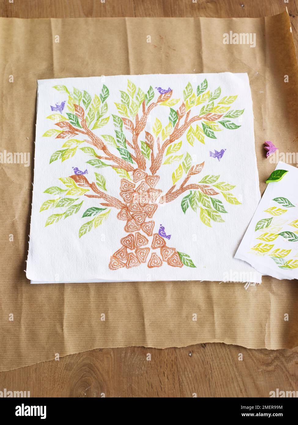 Creating tree and birds stamped design for cushion cover Stock Photo ...