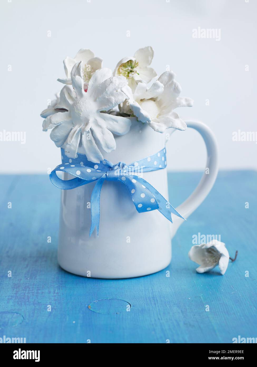 Plaster flowers in jug Stock Photo - Alamy