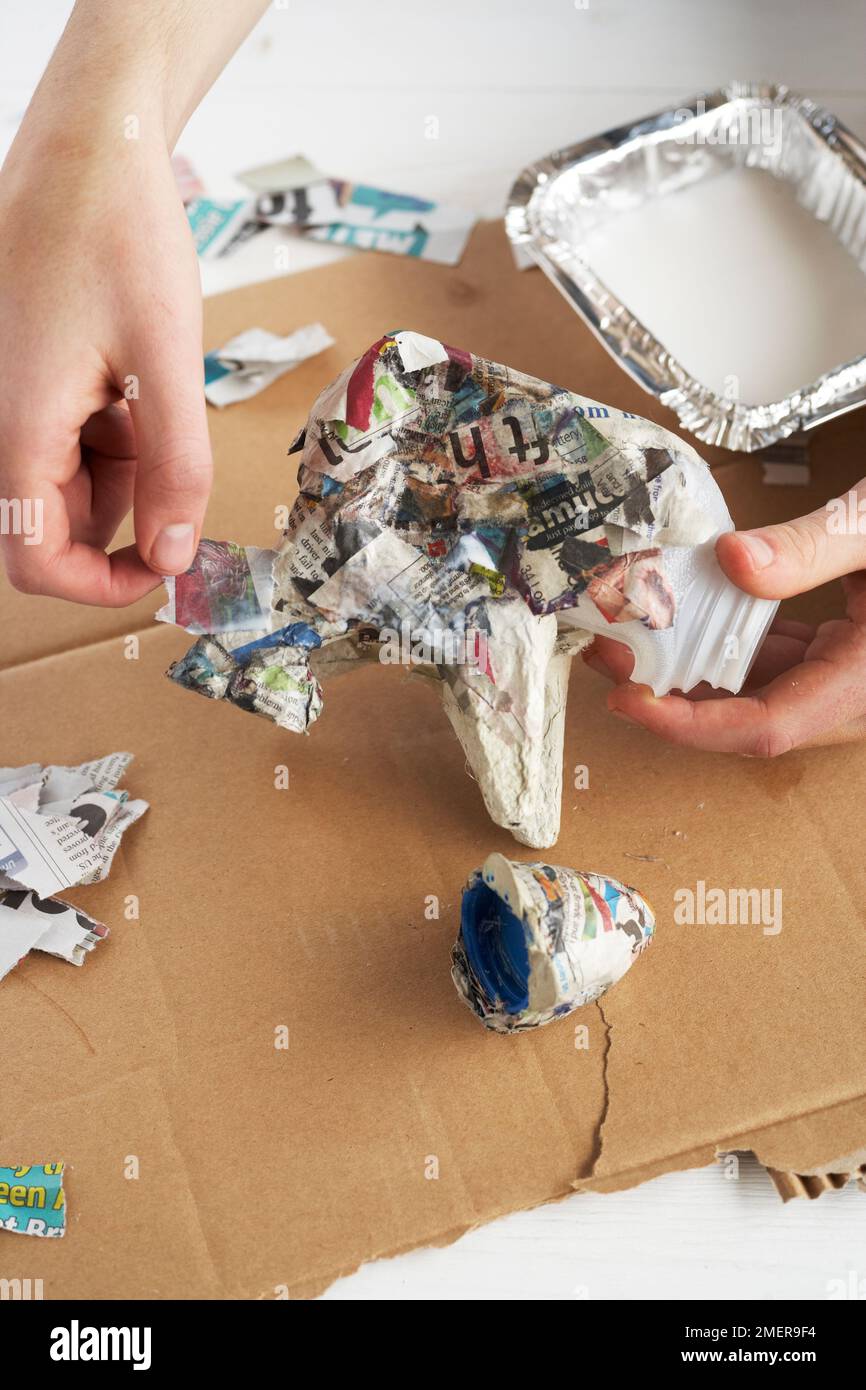 Making papier-mache polar bear piggy bank using old milk bottle Stock ...