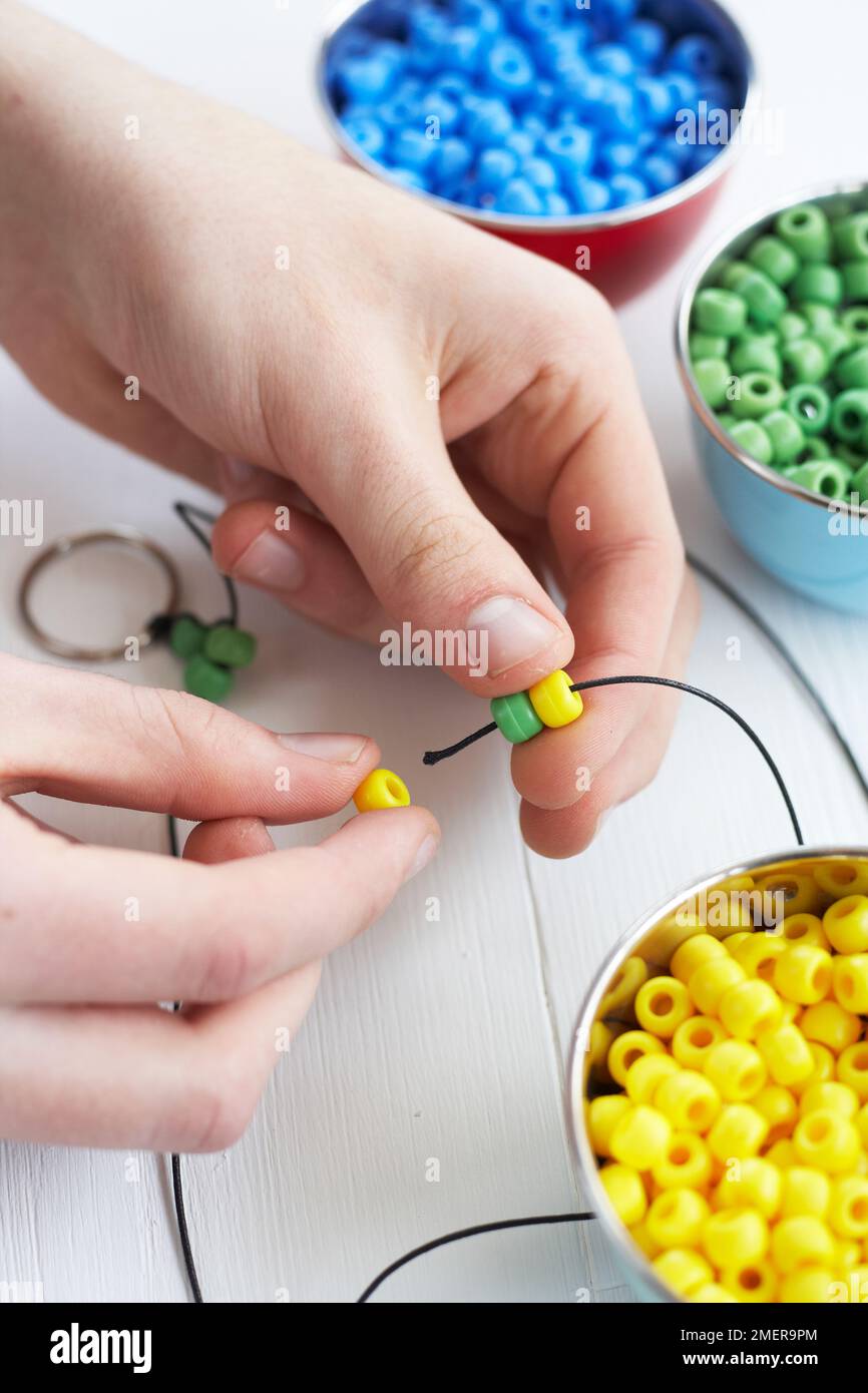 Threading beads hi-res stock photography and images - Alamy