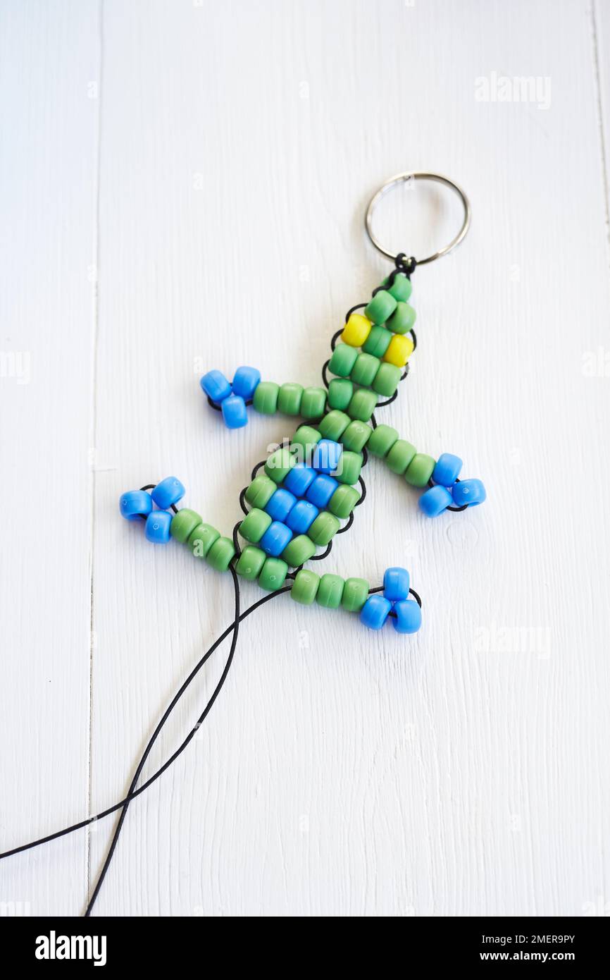 Making beaded lizard key ring Stock Photo - Alamy