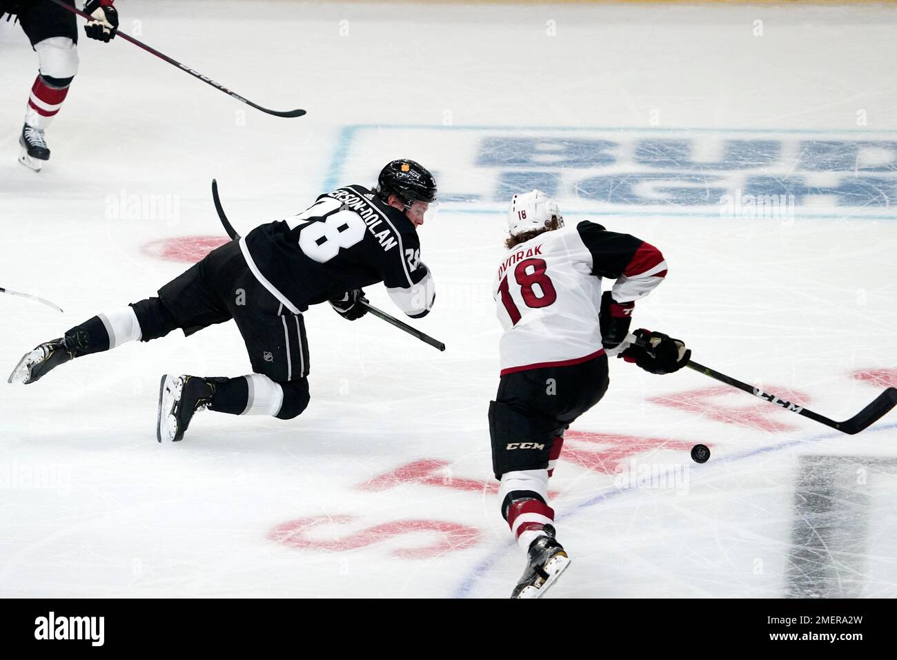 Los Angeles Kings center Jaret Anderson-Dolan, left, and Arizona ...