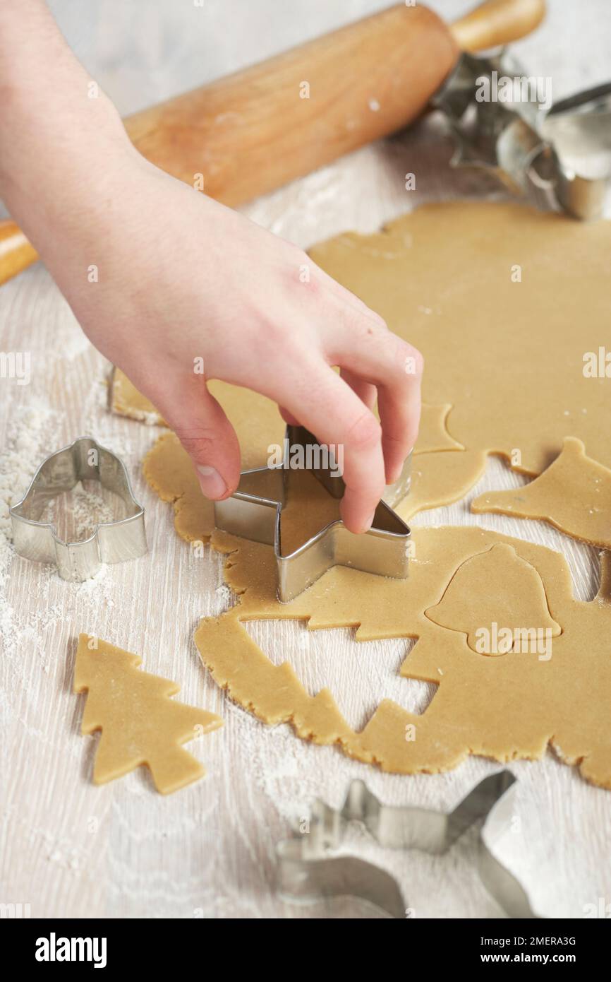 Cutting christmas tree indoor hi-res stock photography and images - Alamy