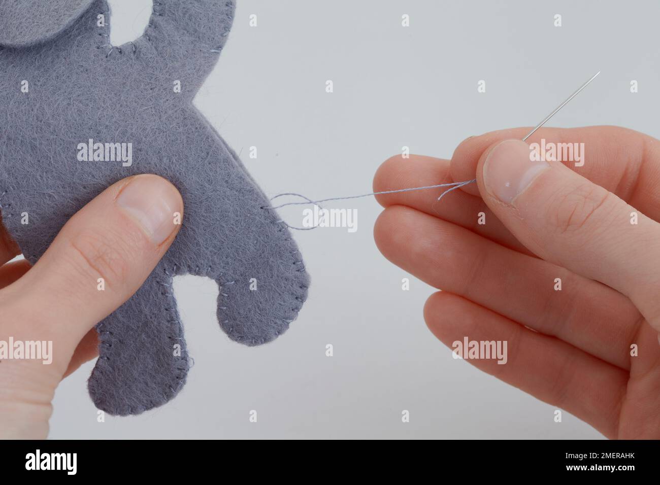 Making animal mobile, sew together two halves using blanket stitch, toy ...