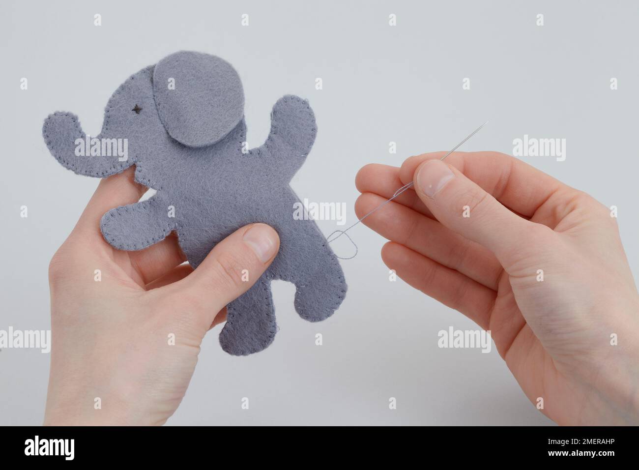 Making animal mobile, sew together two halves using blanket stitch, toy ...