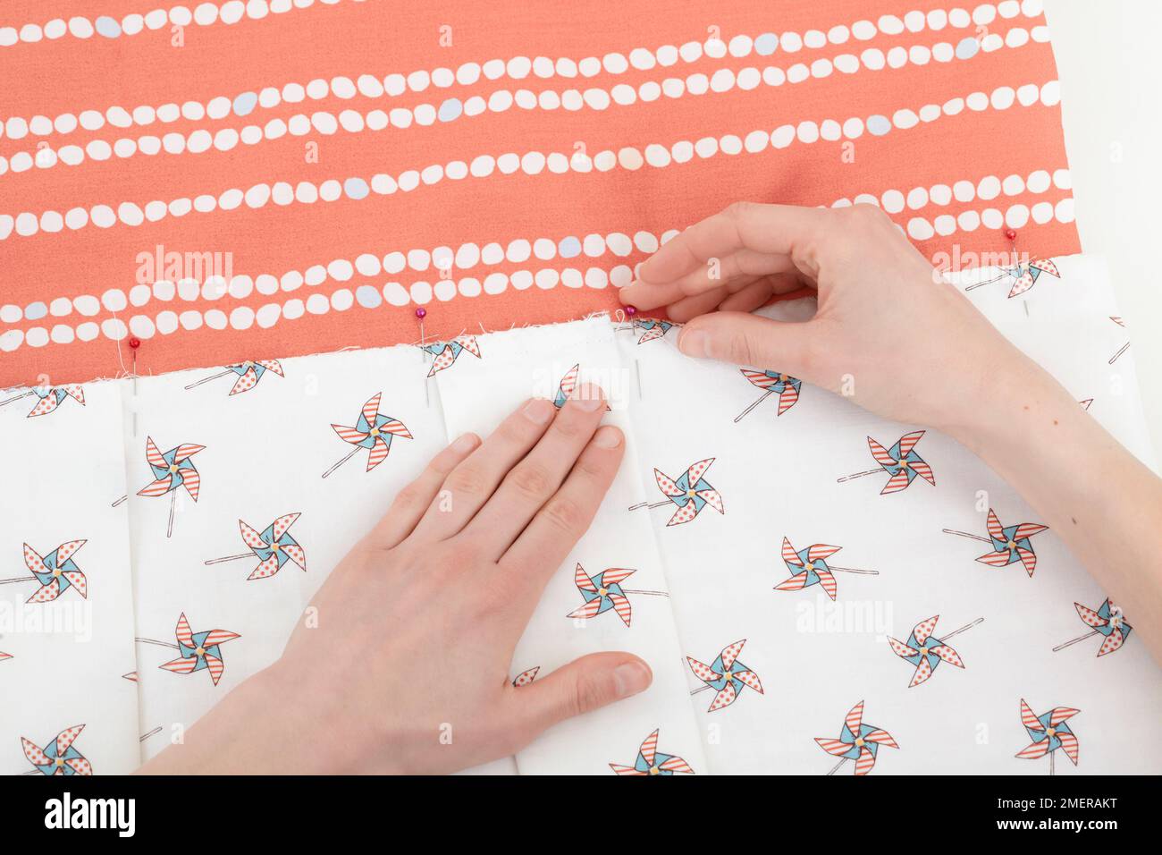 Pin two pieces of fabric together, making cot hanger or cot organiser ...