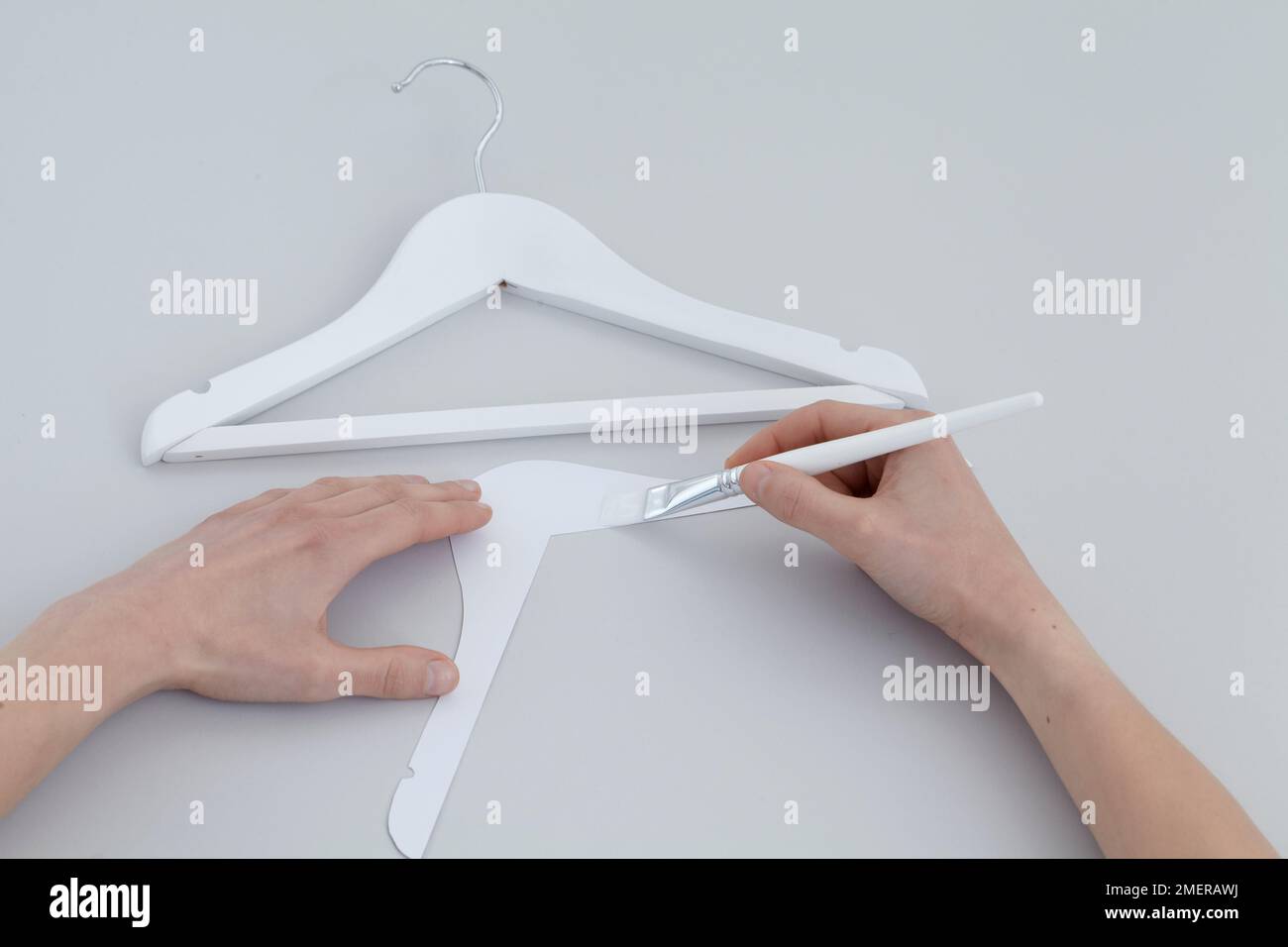 Hanger, glue back of paper Stock Photo - Alamy