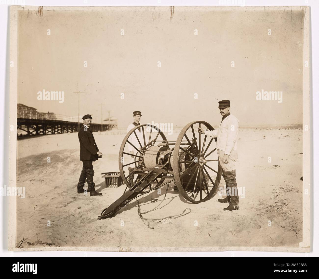 A Coast Guard line-throwing gun mounted on a two-wheel carriage is used ...