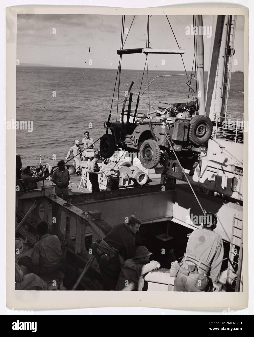Cesar Romero is seen aboard a Coast Guard-manned transport vessel ...