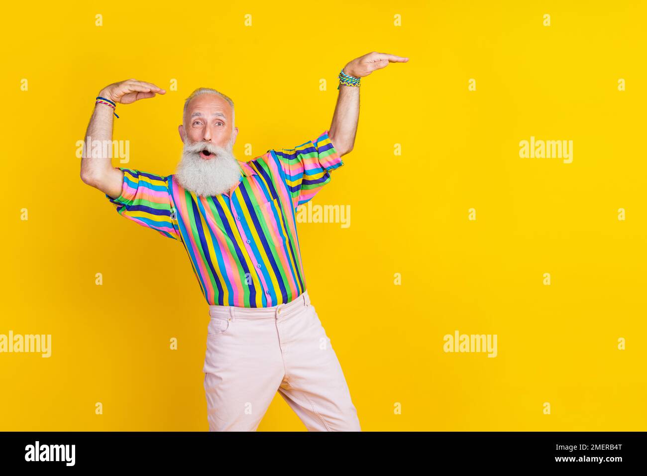 Photo of good mood pretty guy dressed striped shirt dancing disco empty ...