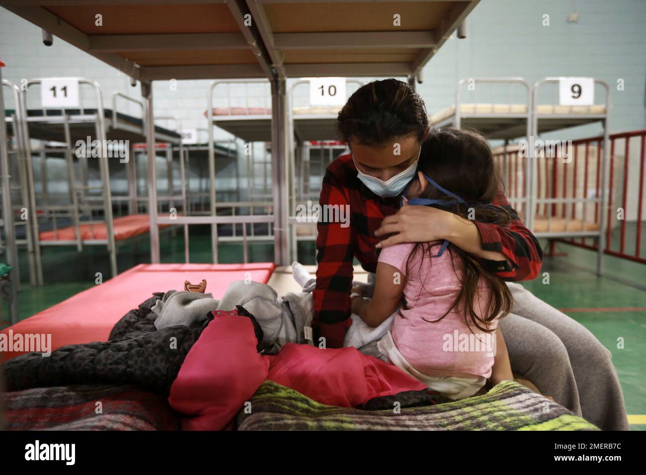 Ana Maria Moreno Portillo from Guatemala embraces her daughter after ...