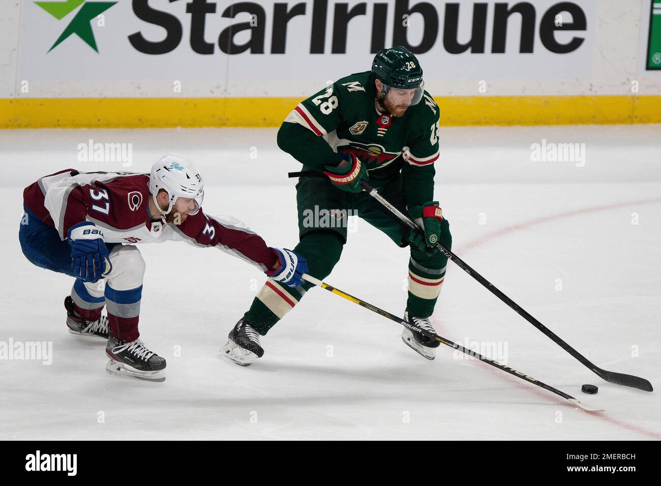 Minnesota Wild's Ian Cole (28) handles the puck against Colorado ...