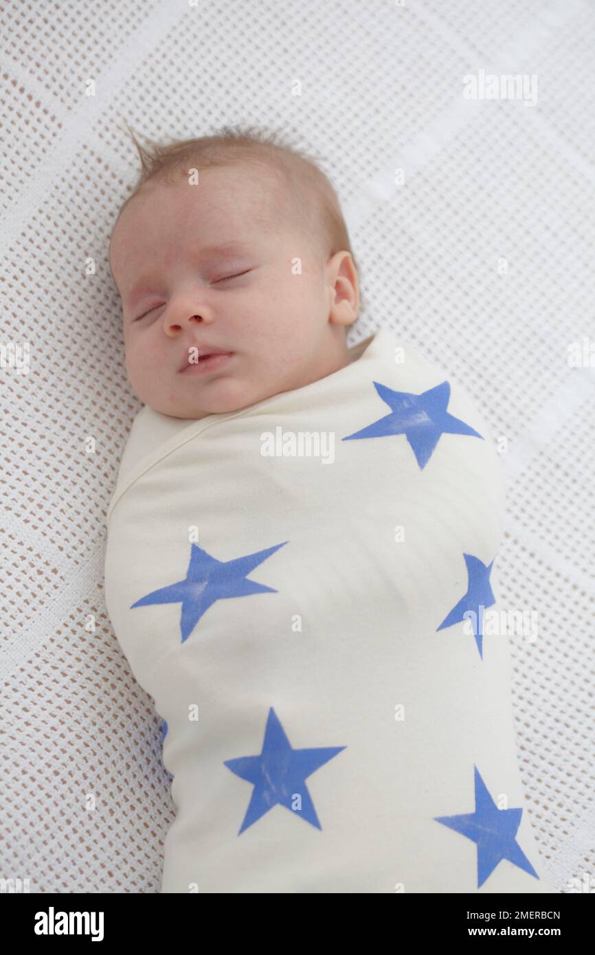 Baby wrapped in blanket hi-res stock photography and images - Alamy