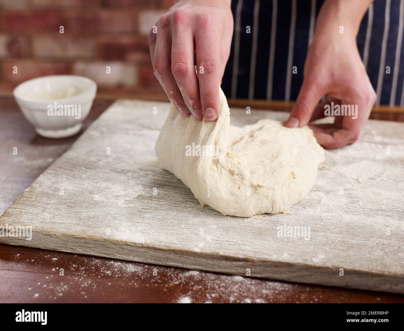 Making bread, kneading dough on floured surface Stock Photo - Alamy