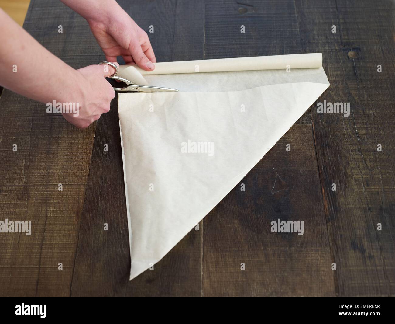 Gingerbread, cutting white baking paper in triangles Stock Photo - Alamy