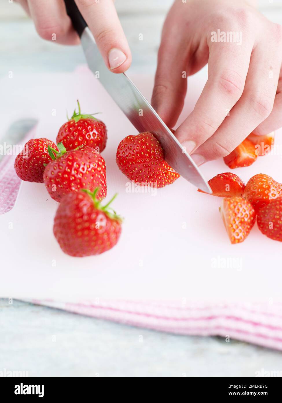 Person cutting strawberries on hi-res stock photography and images - Alamy