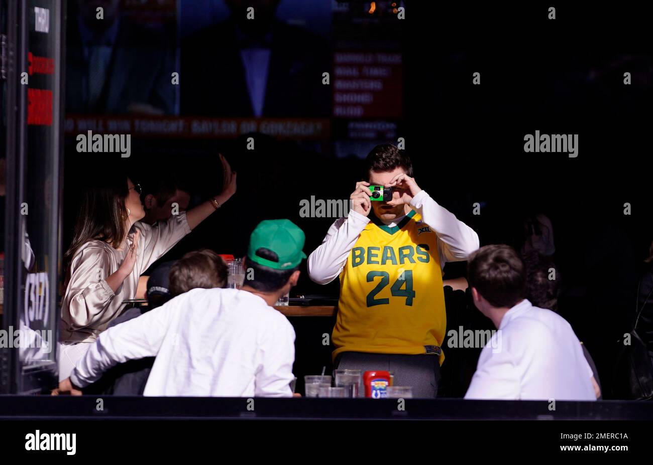 Baylor fans take a photo in a sports bar before Baylor plays Gonzaga in ...