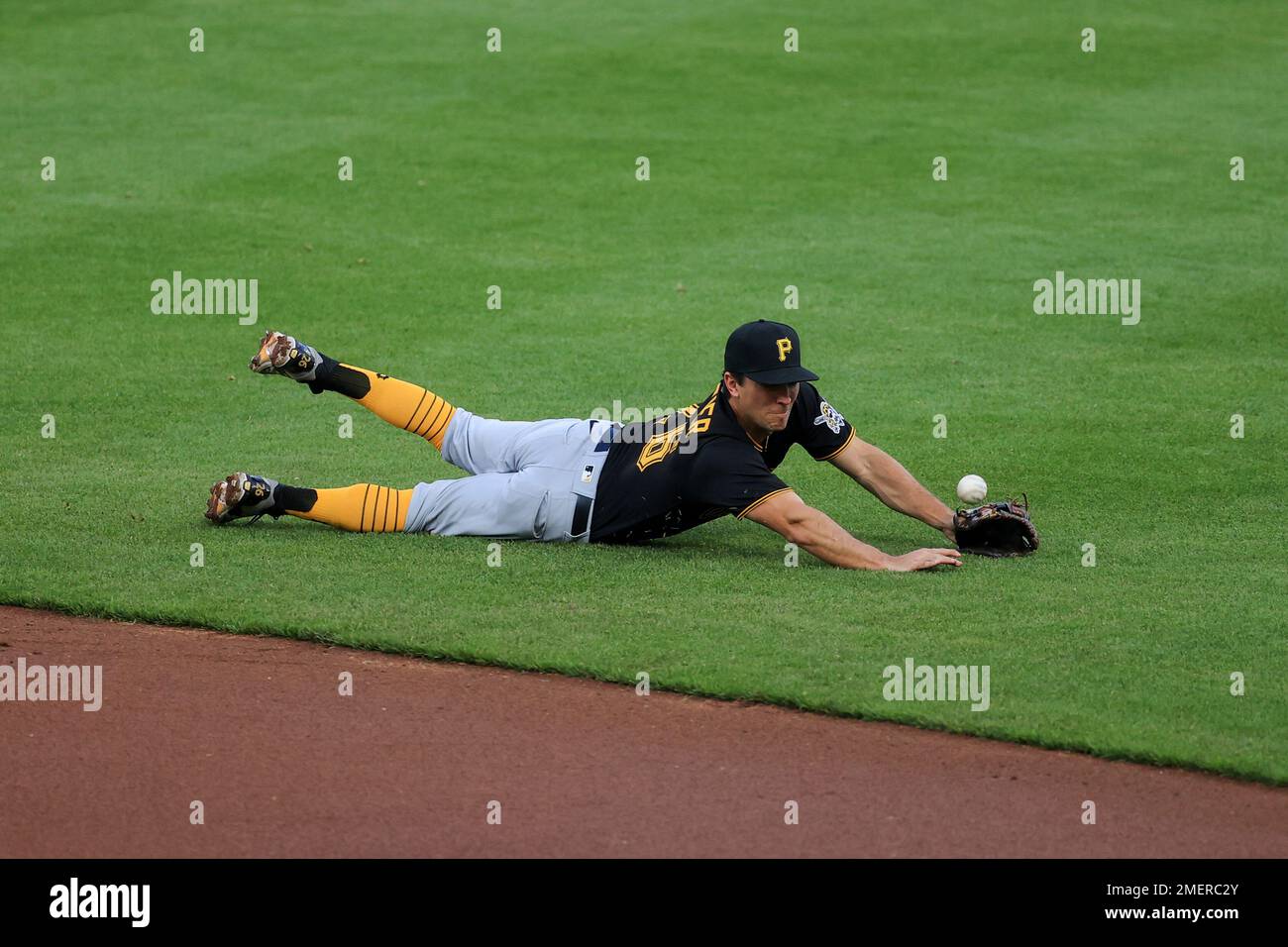 Pittsburgh Pirates' Adam Frazier dives and is unable to field the ball ...