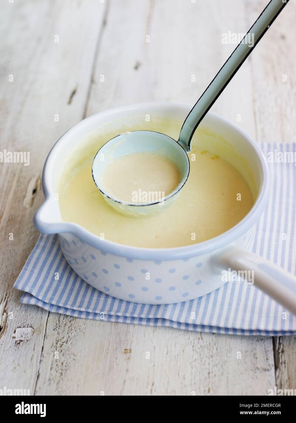 Cheesy white sauce Stock Photo - Alamy