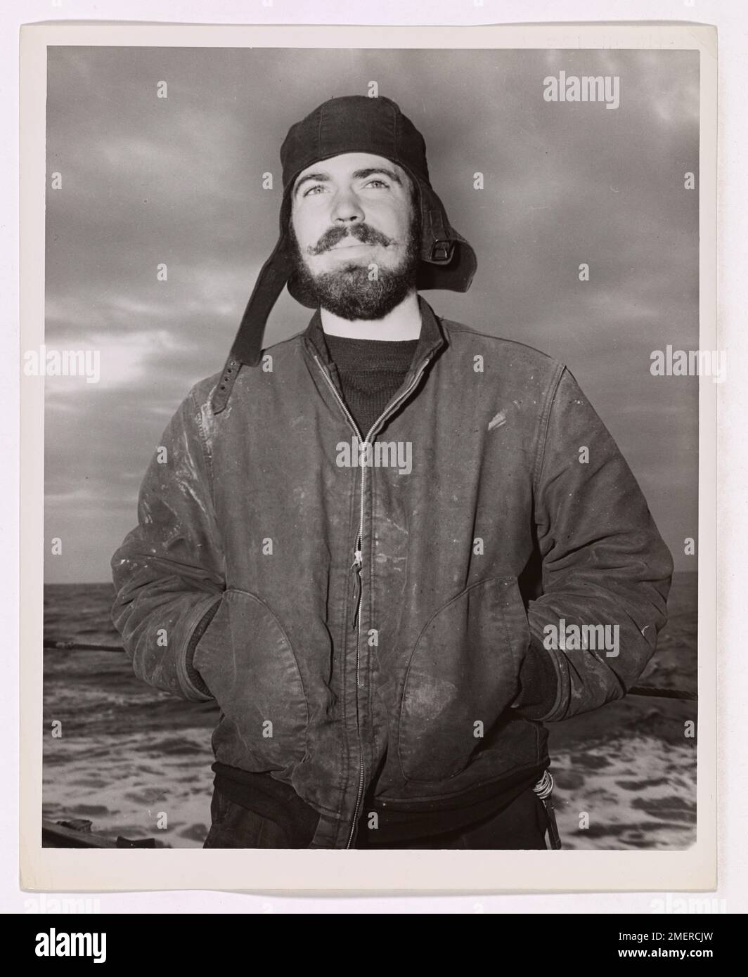 Watchman of the North Atlantic. This image depicts a Coast Guardsman on ...