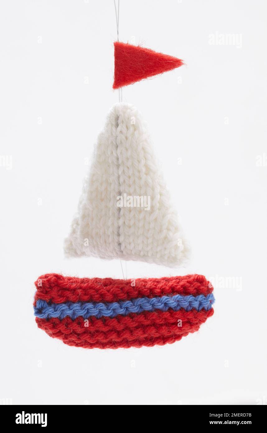 Knitted sailing boat, part of mobile Stock Photo - Alamy