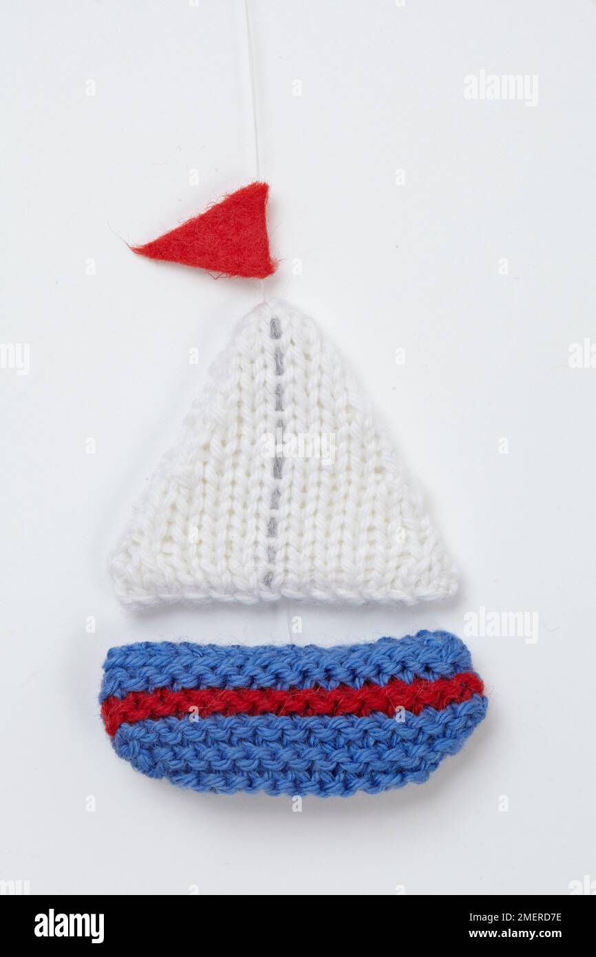 Knitted sailing boat, part of mobile Stock Photo - Alamy