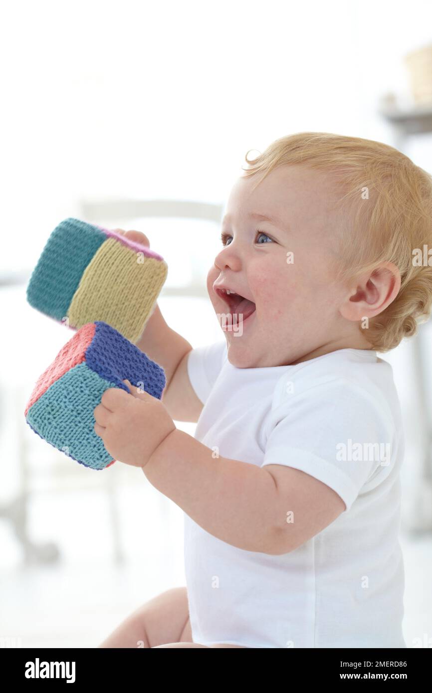 Baby 10 months blocks hi-res stock photography and images - Alamy
