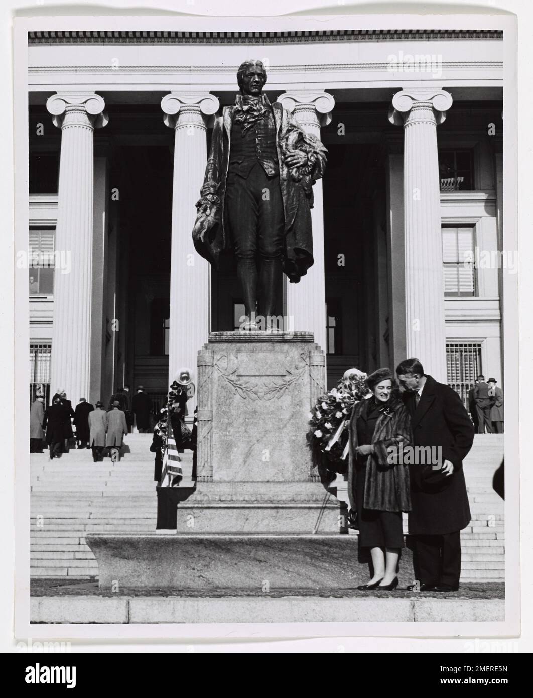 A man and woman stand together in front of the Alexander Hamilton ...