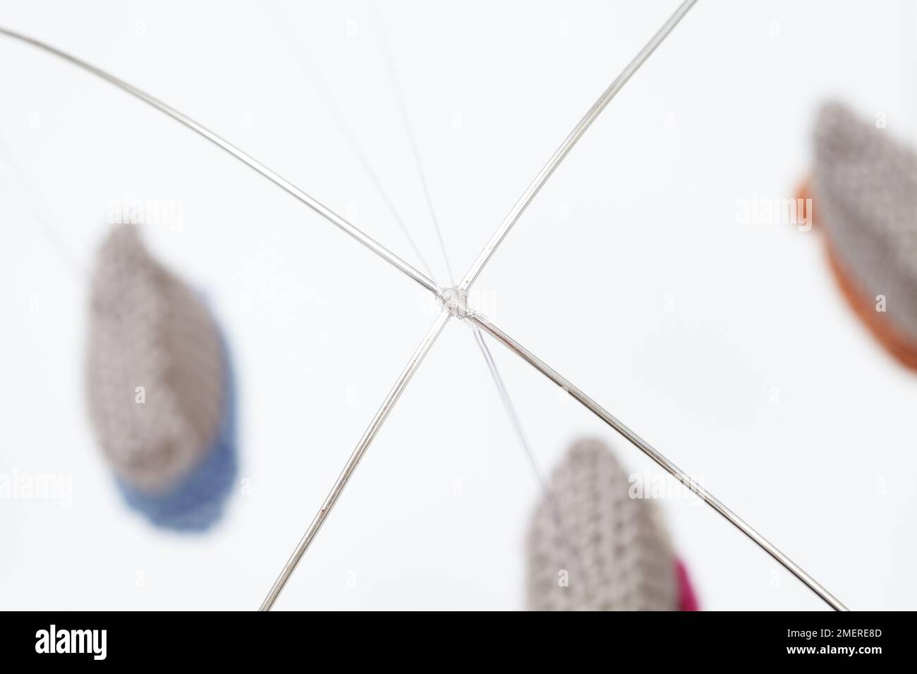 Sticks and thread of mobile Stock Photo - Alamy