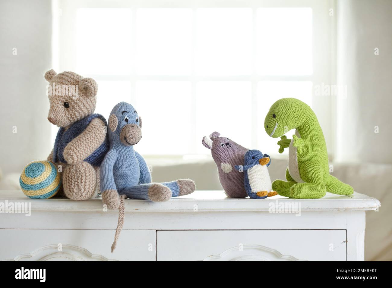 Selection of knitted toys, bear, monkey, mouse, penguin and dinosaur ...