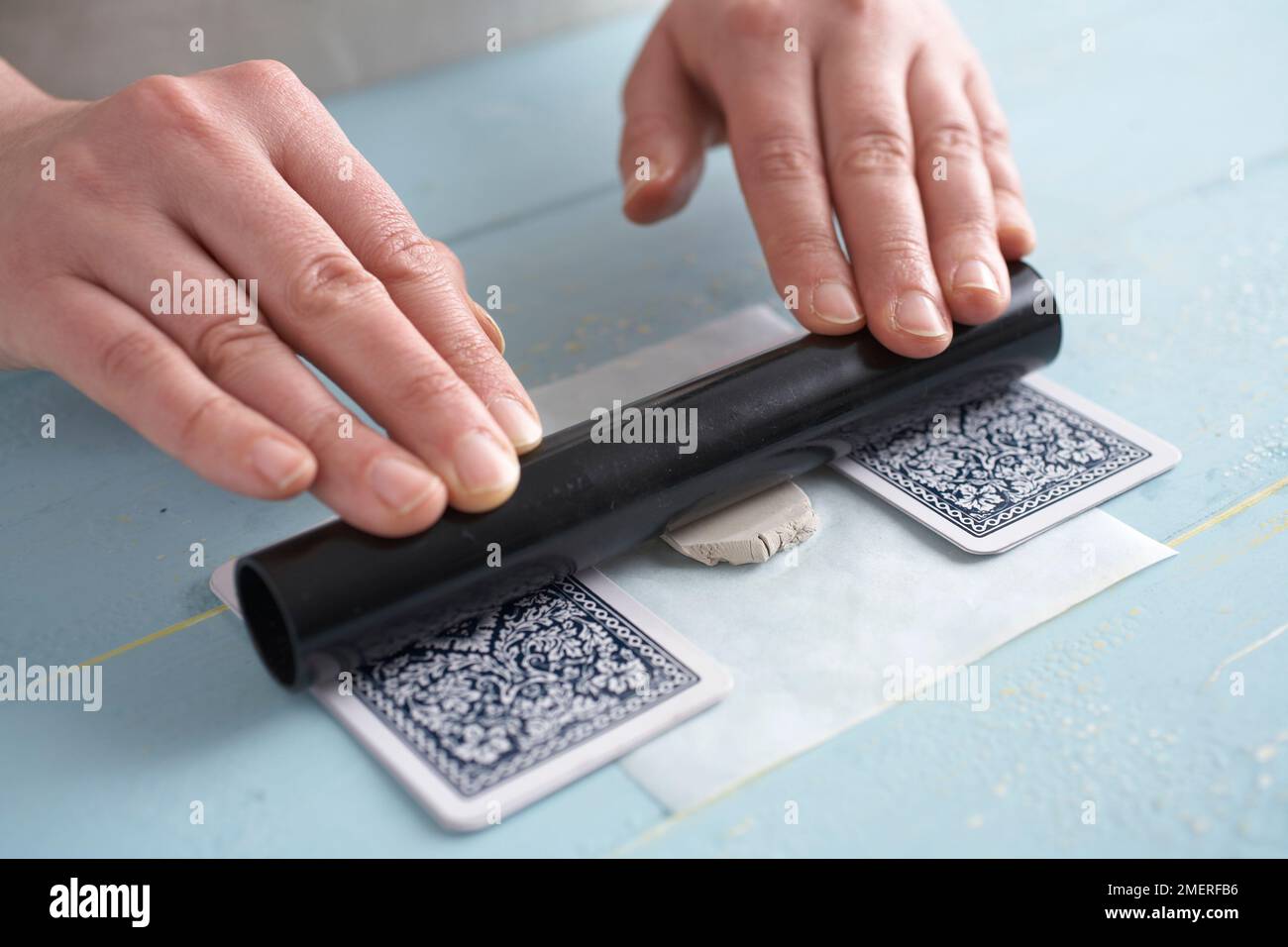 Making silver clay jewellery, Two stacks of four playing cards to act ...