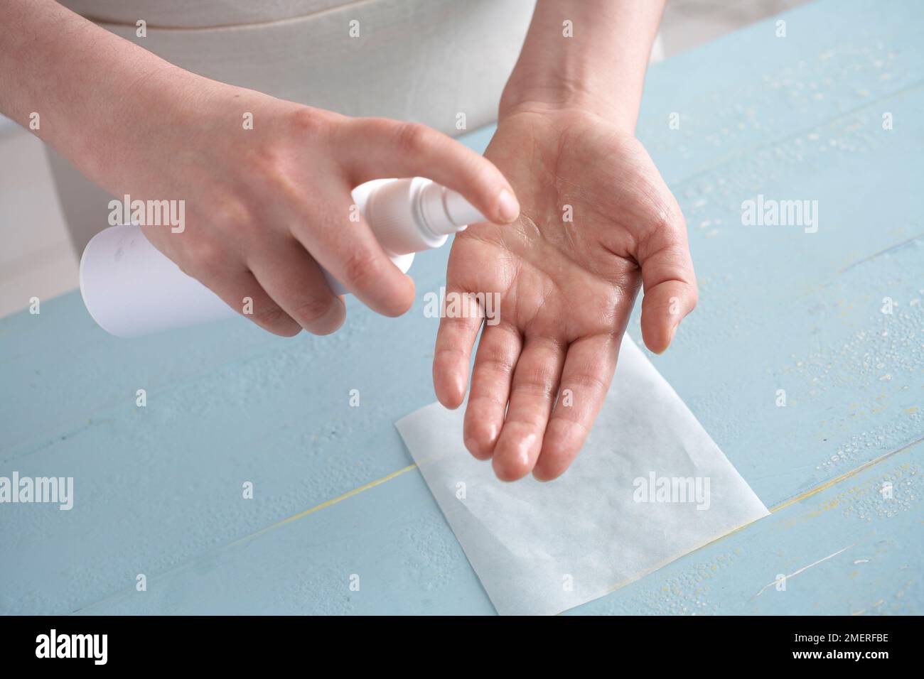 Squirting oil on hands and work surface Stock Photo - Alamy