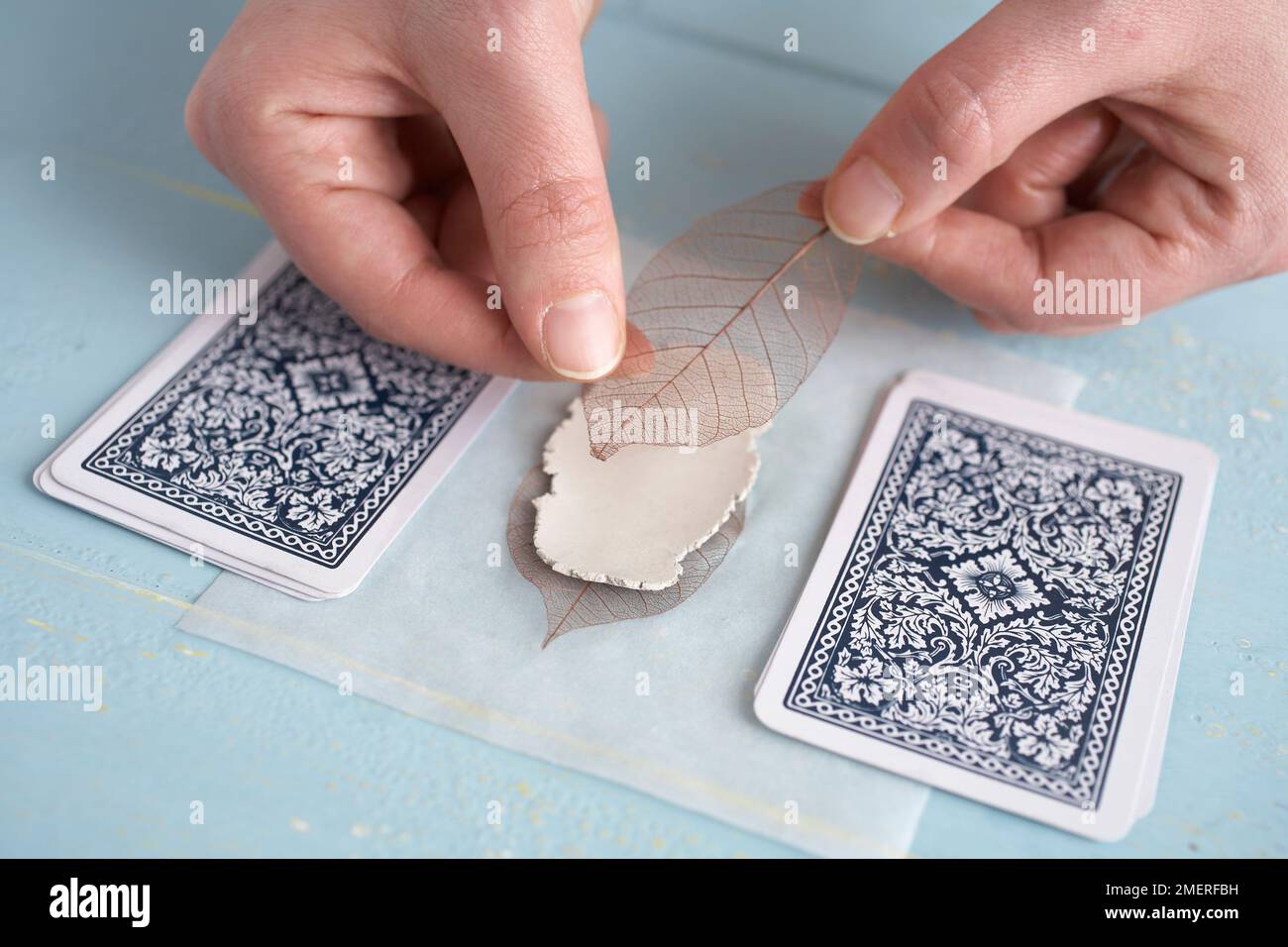 Making silver clay jewellery, Rolled clay with a leaf placed underneath ...