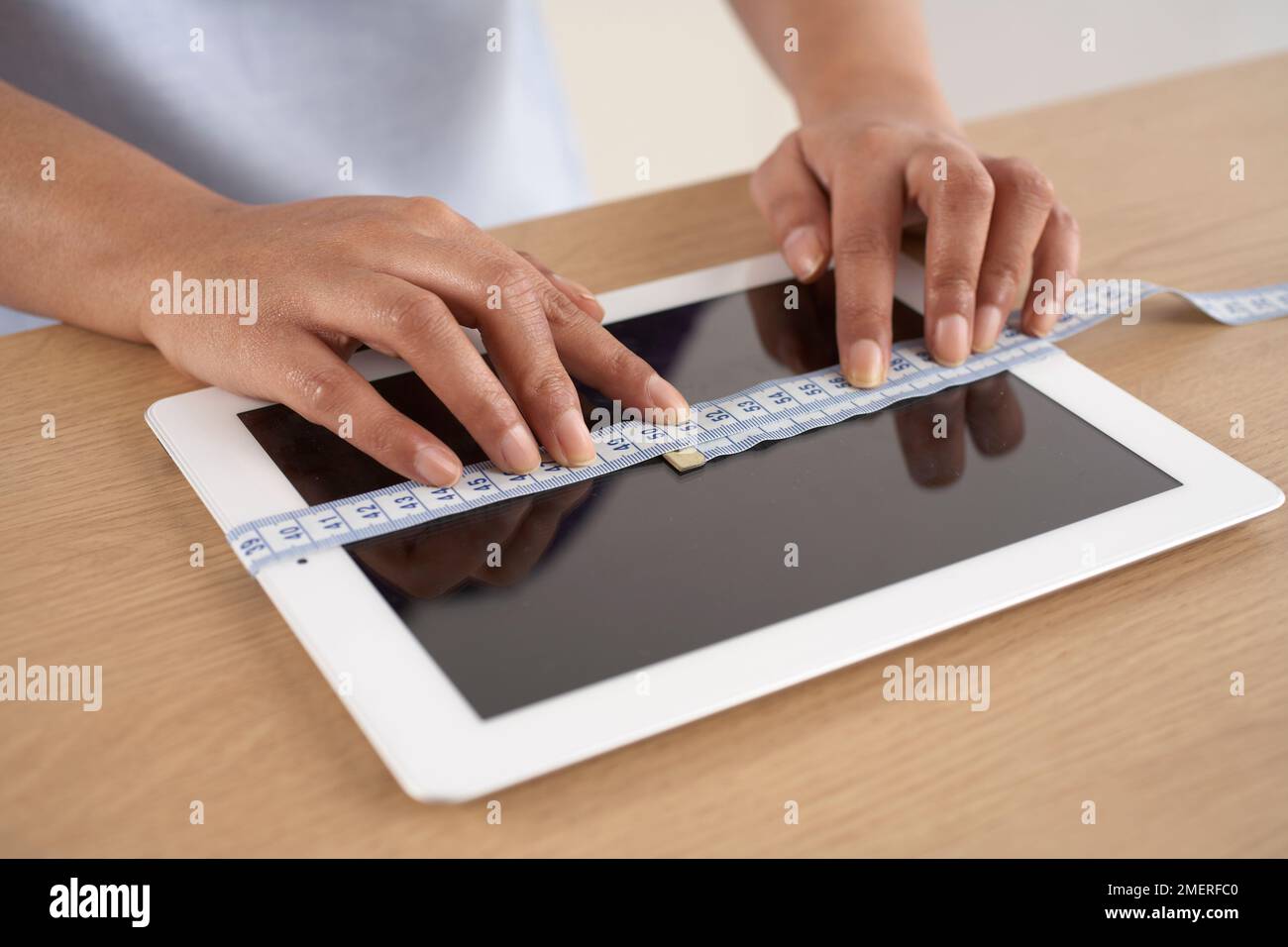 Making device protector, measuring length of device Stock Photo - Alamy