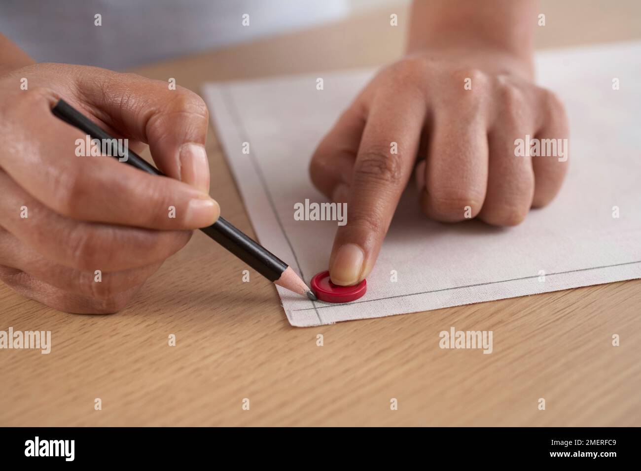 Making a device protector, rounding out the bottom corners Stock Photo ...