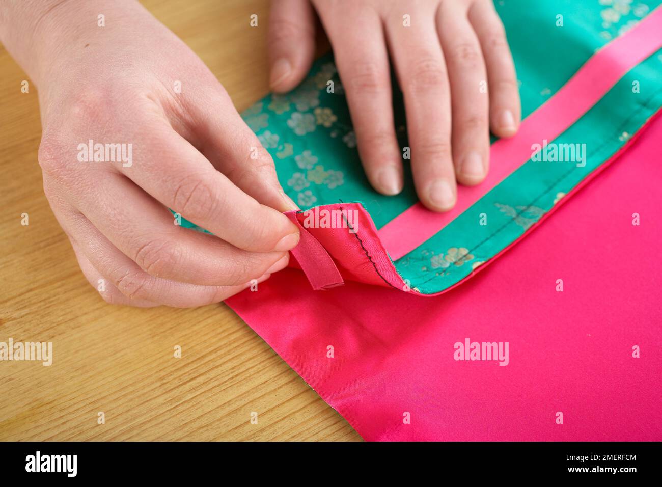Thai silk manicure roll, fold the top stitched edge Stock Photo - Alamy