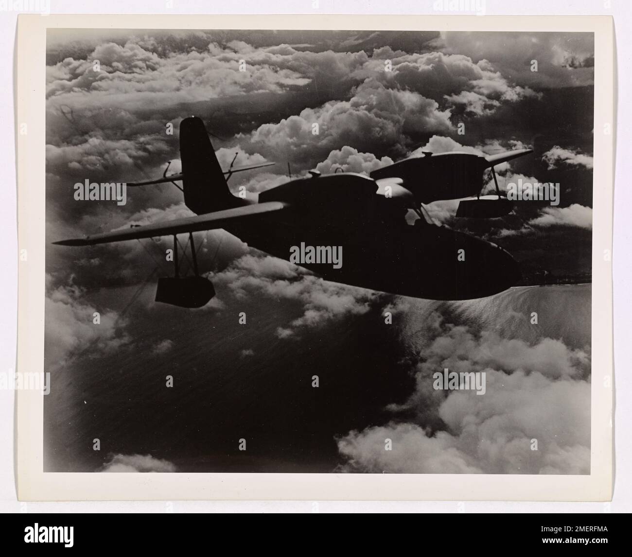 A Coast Guard patrol plane is seen navigating through the clouds ...