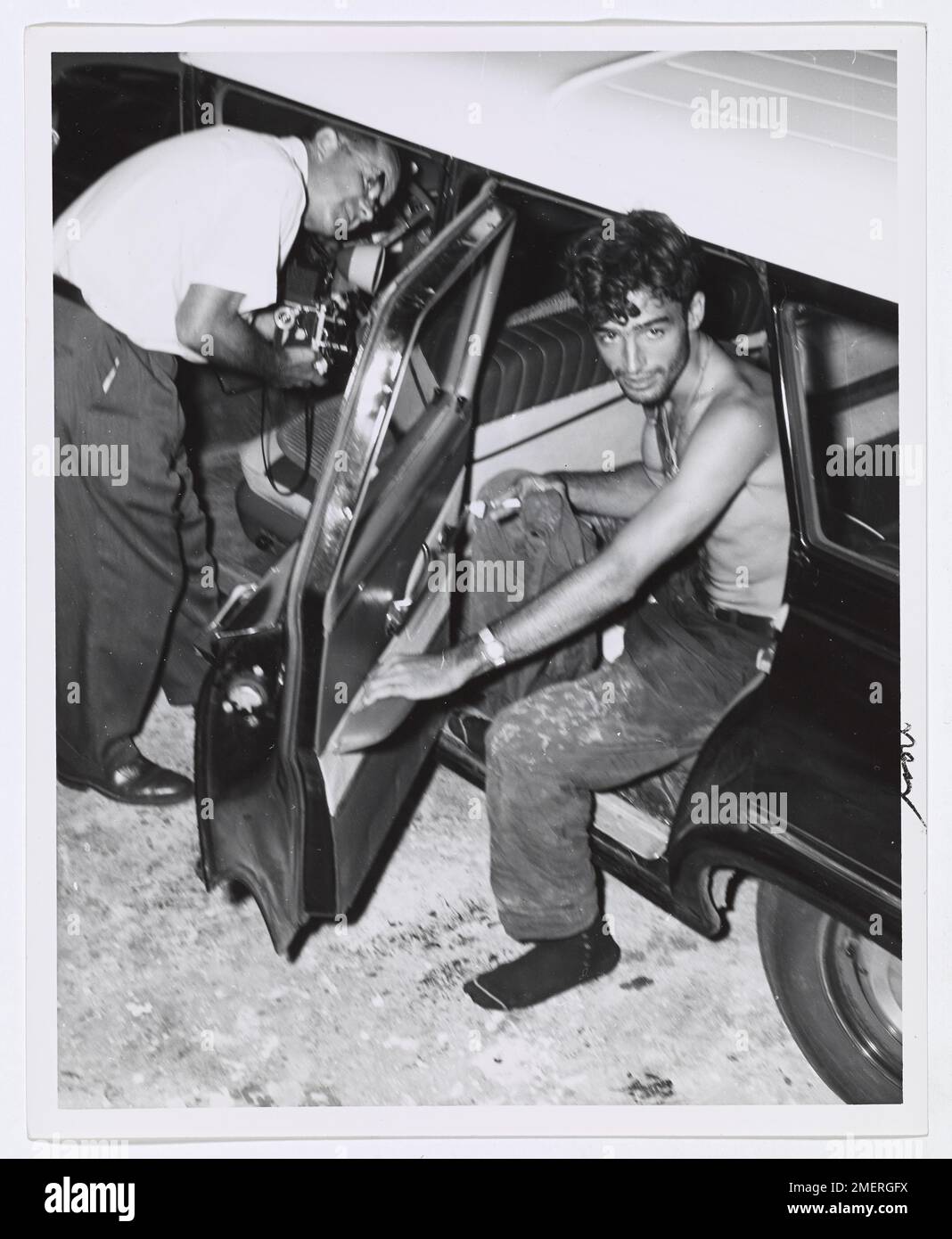 A photograph showing a young refugee being driven away, possibly from a ...