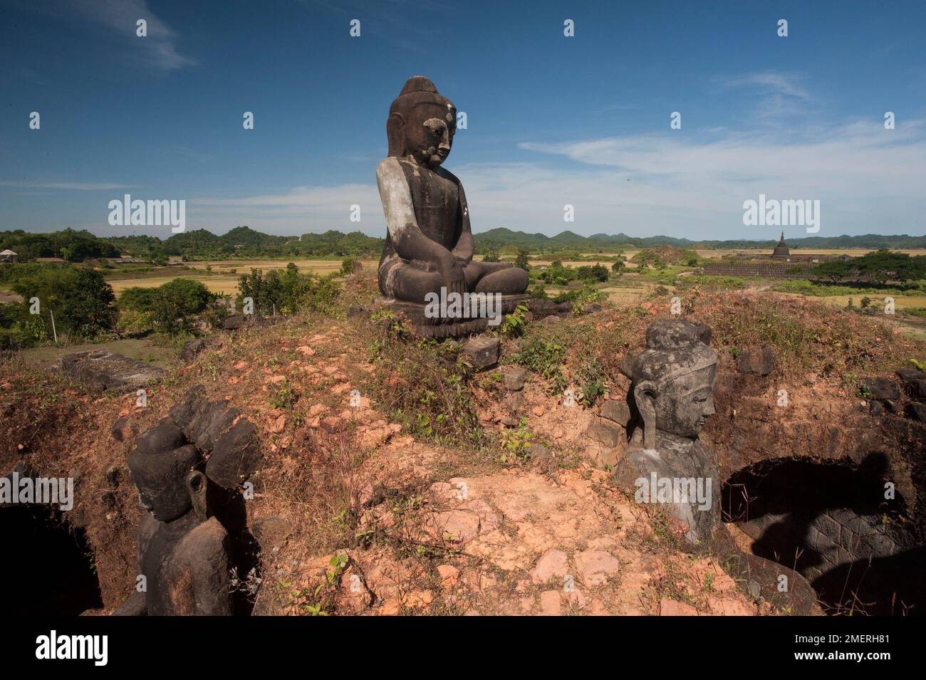 Myanmar, buddha statue on top of ruin Stock Photo - Alamy