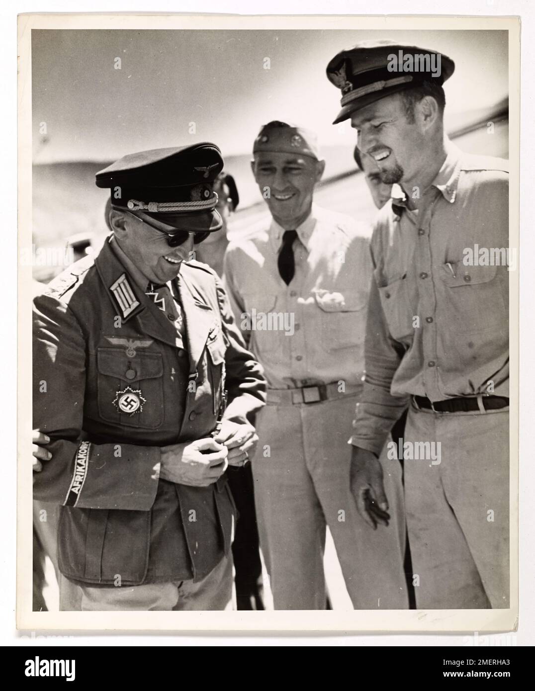 Captured German officer from the Afrika Korps shares a moment with an ...